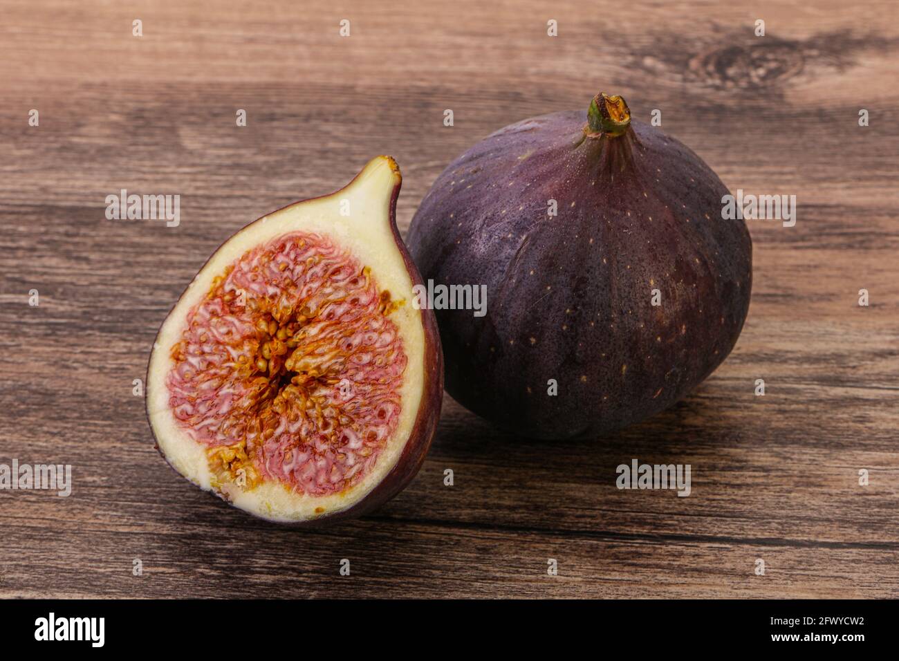 Sweet purple slice of fig fruit Stock Photo - Alamy