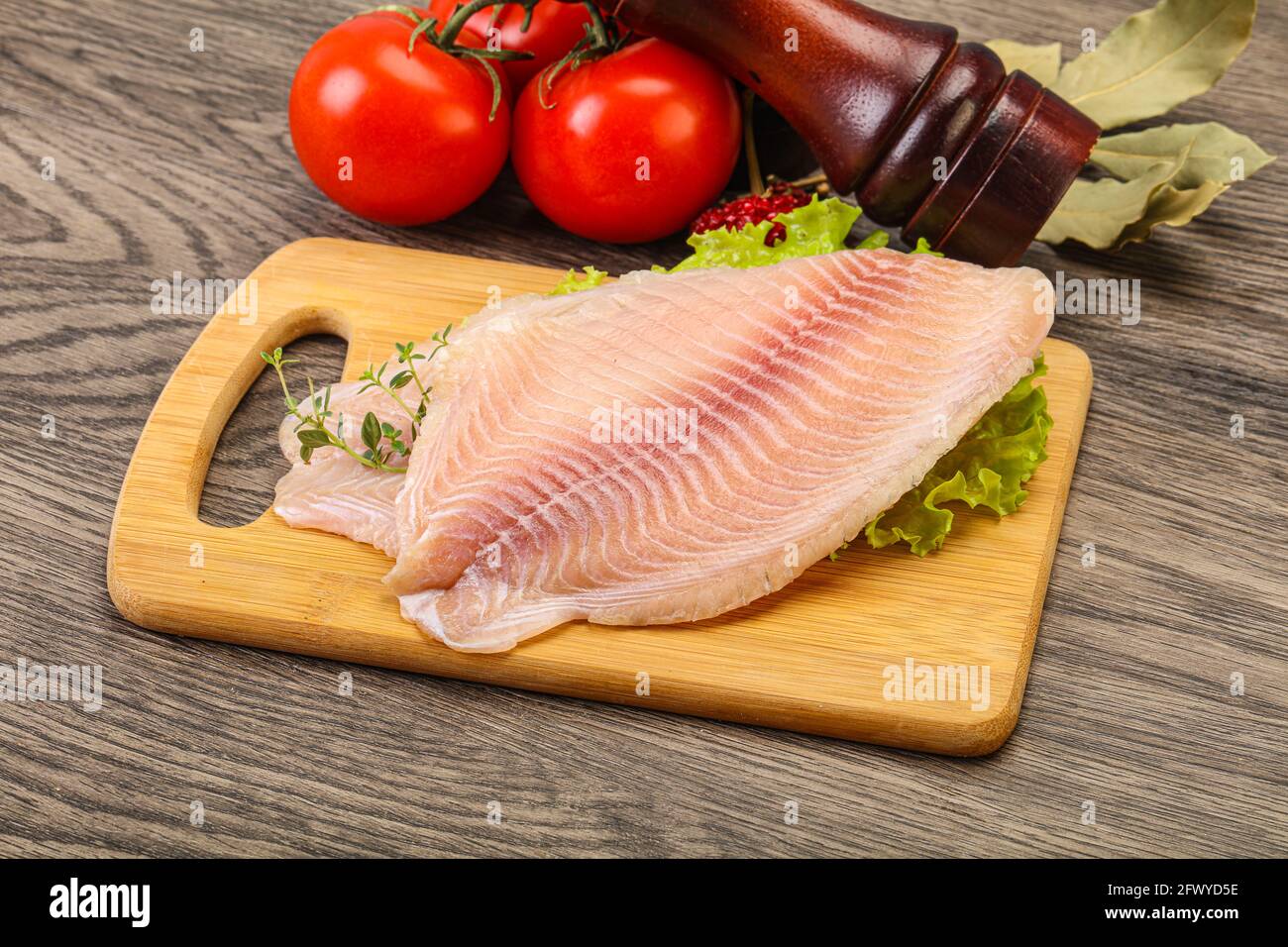 Raw tilapia fish fillet for cooking Stock Photo - Alamy