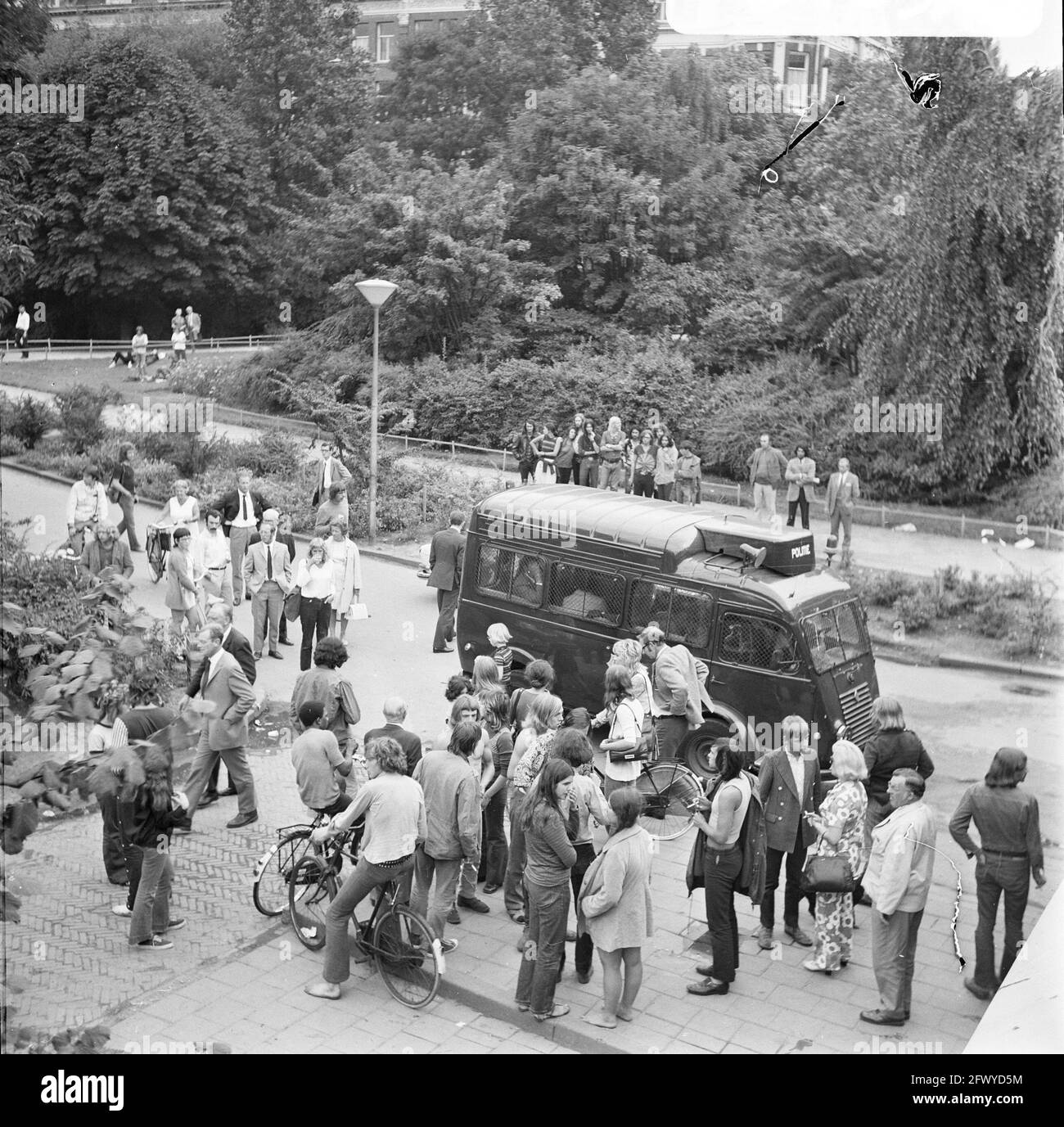 Detectives of police (in white suits) make arrests in Studio 7 in ...