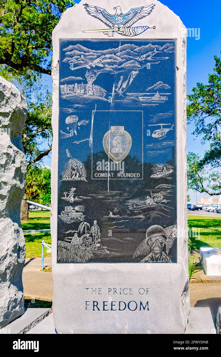 Headstones featuring photographs and inscriptions honor local veterans ...