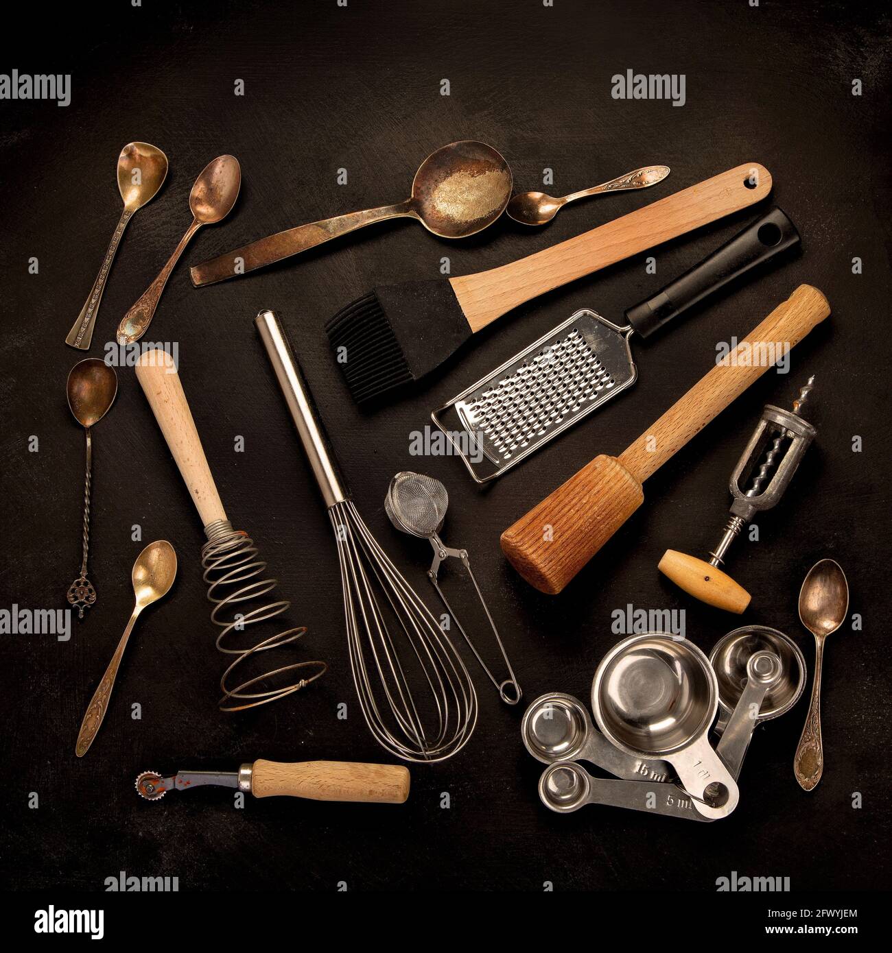 Set of kitchen utensils on black background. Tools for cooking. Top ...