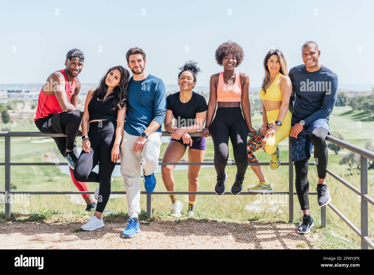 Group portrait of runners smiling at camera. Horizontal framing Stock ...