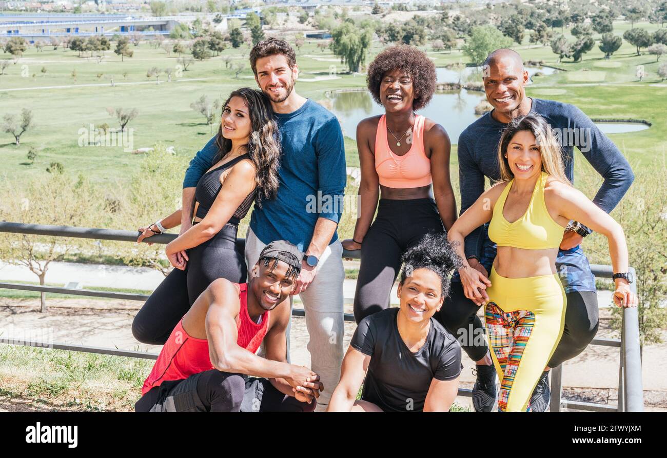 Group portrait of runners smiling at camera. Horizontal framing Stock ...