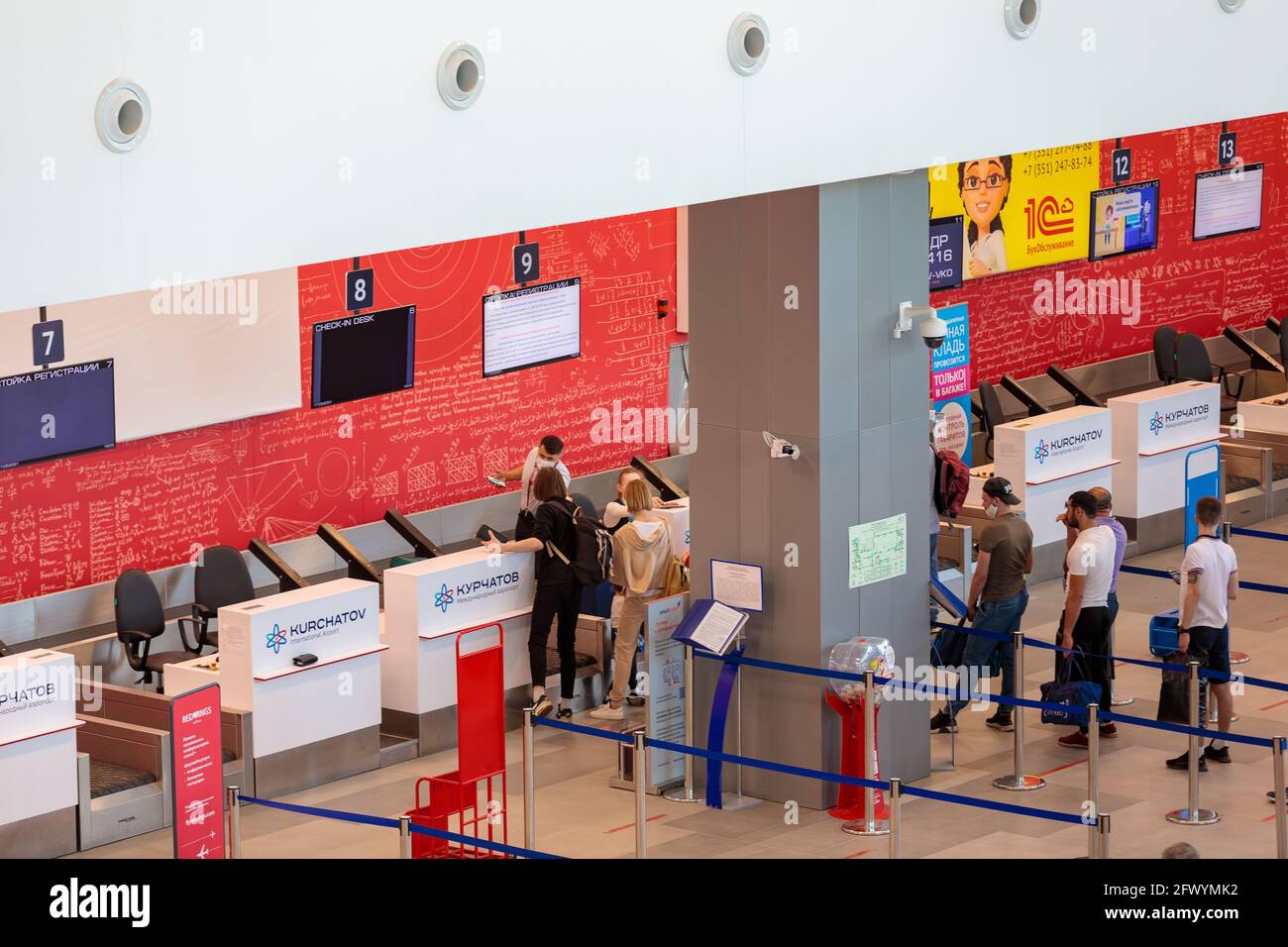 The queue of people at the airport is at the check-in counter Stock ...