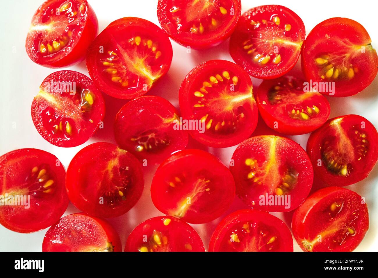 fresh cut cocktail tomatoes Stock Photo - Alamy