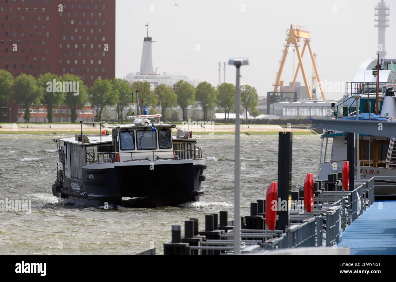 Rotterdam, Netherlands. 21st May, 2021. A water bus travels on the Maas ...