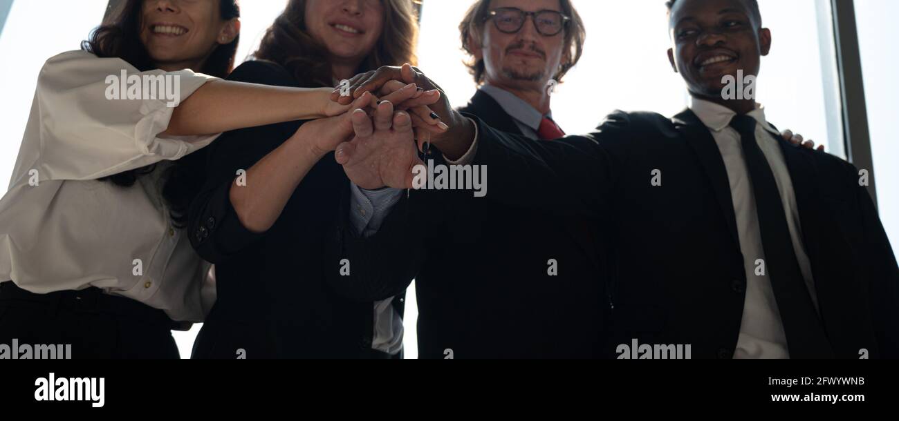 Group of diversity business people hands stack together at the office ...