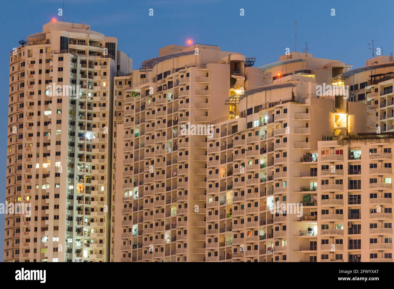 apartment building at night time background Stock Photo - Alamy