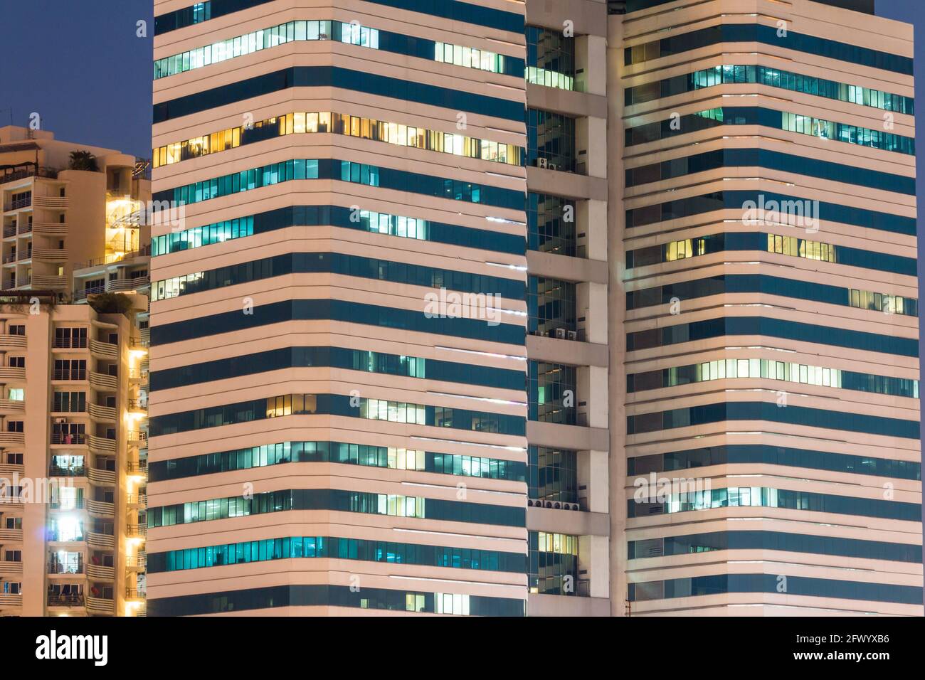 apartment building at night time background Stock Photo - Alamy