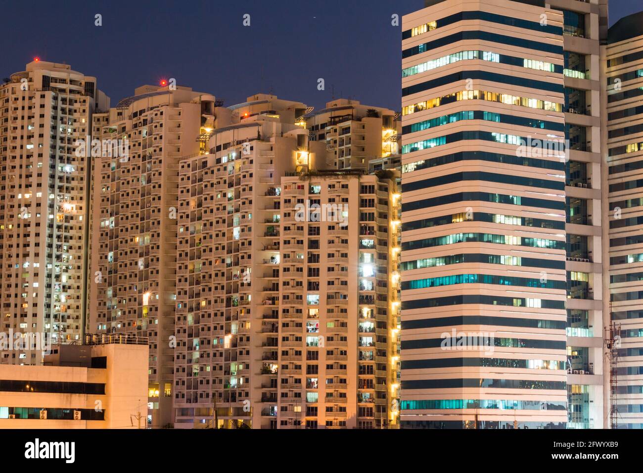 apartment building at night time background Stock Photo - Alamy