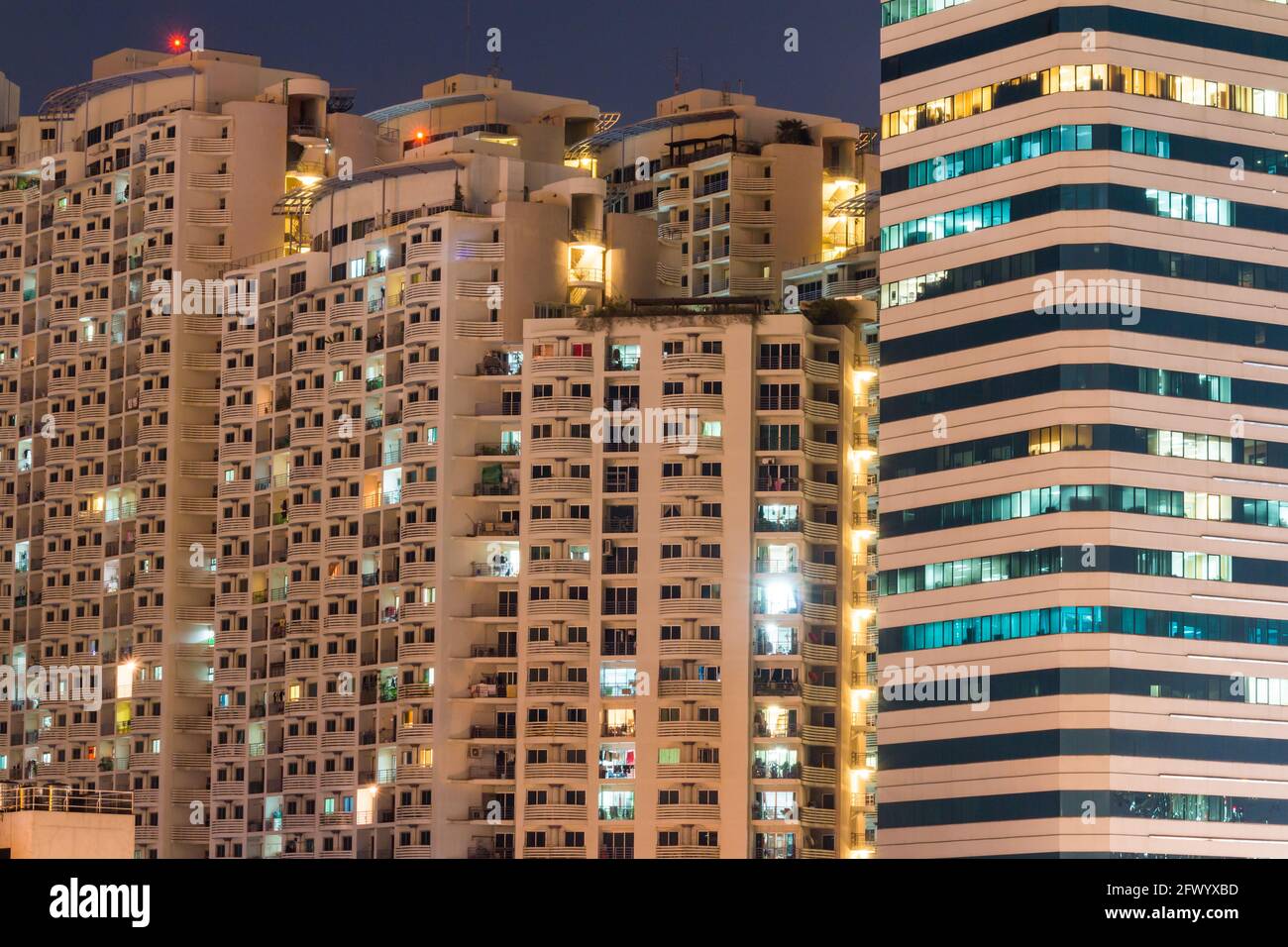 apartment building at night time background Stock Photo - Alamy