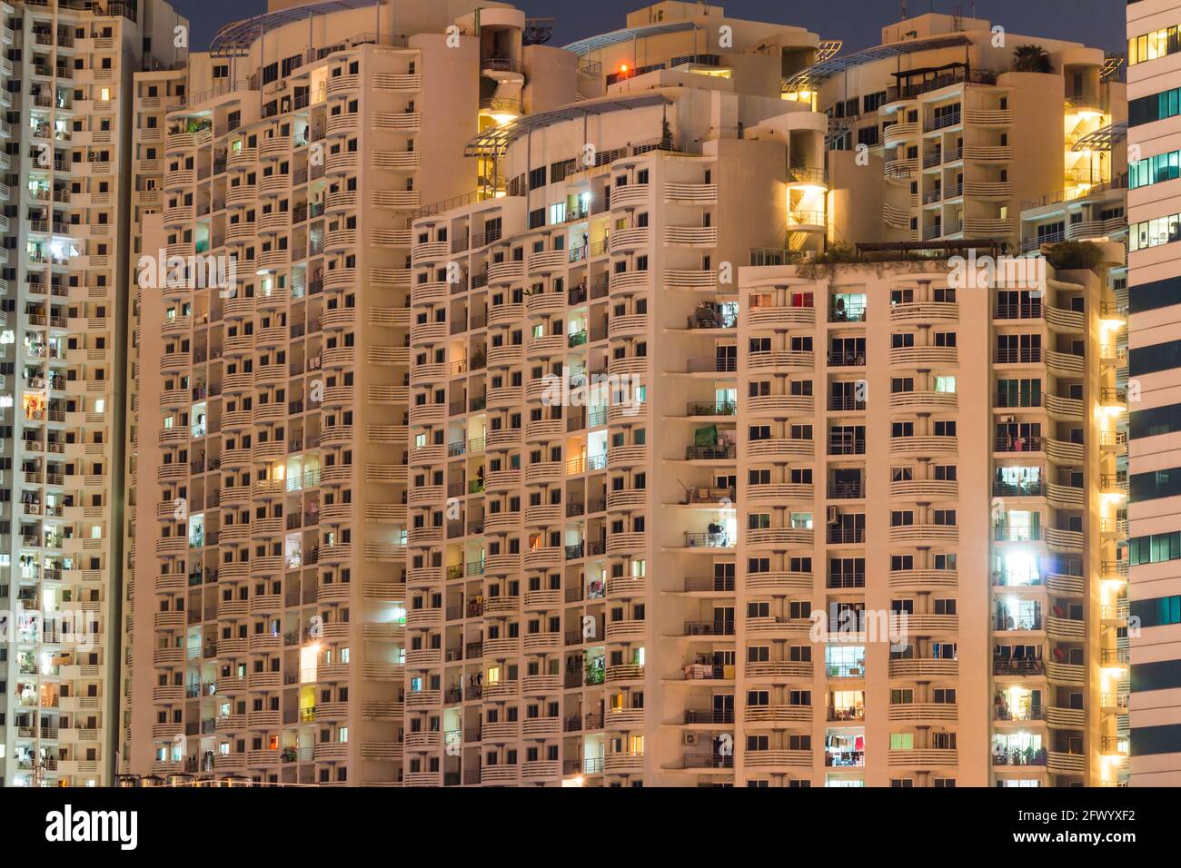 apartment building at night time background Stock Photo - Alamy
