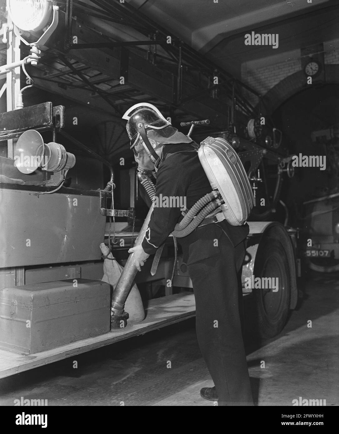 Amsterdam fire department. Firefighter equipped with mask and oxygen ...