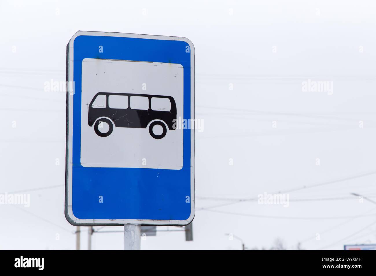 Close up road sign bus stop on gray sky background. City life and road ...