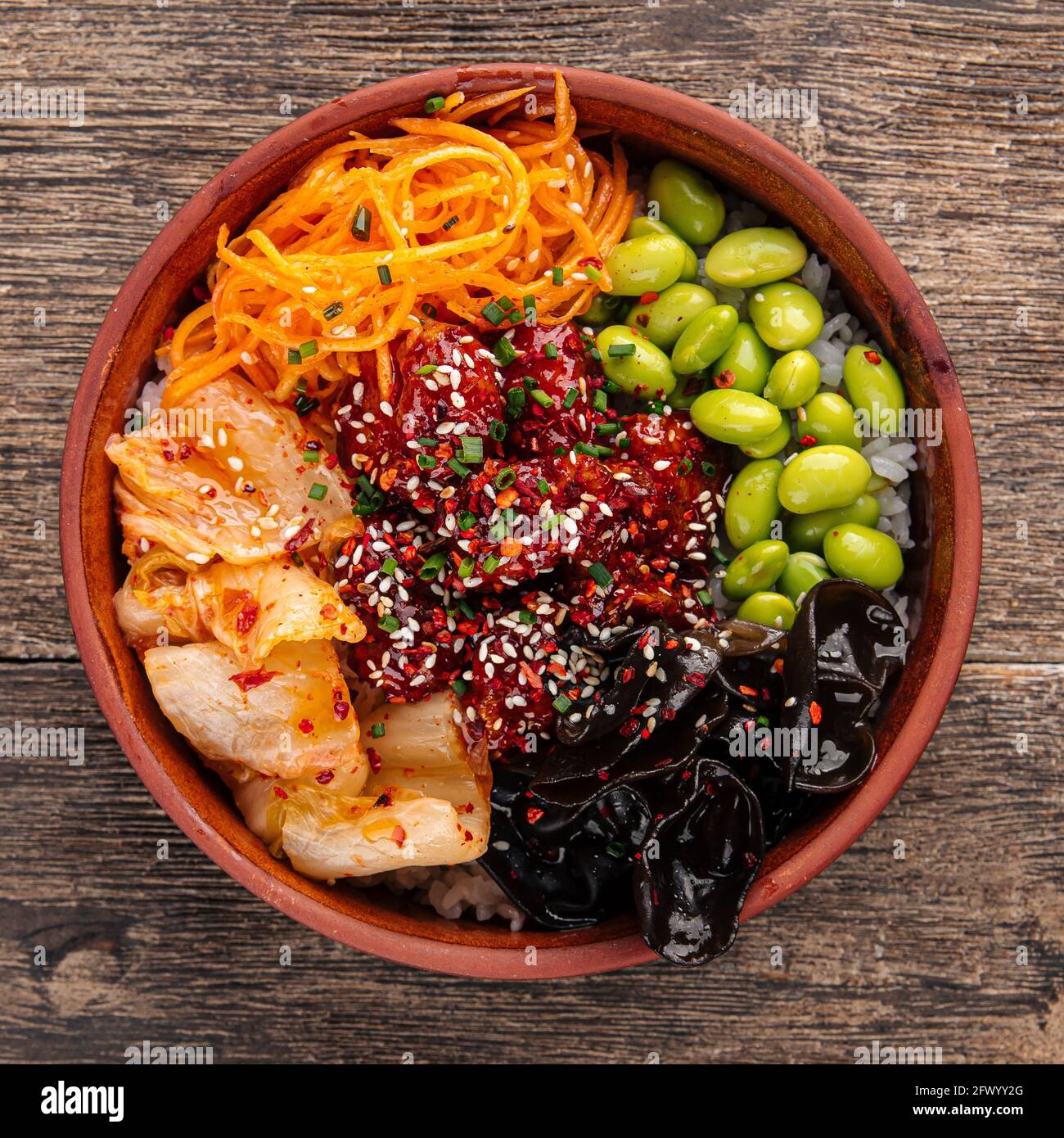 Hawaiian spicy chicken poke bowl with kimchi Stock Photo - Alamy