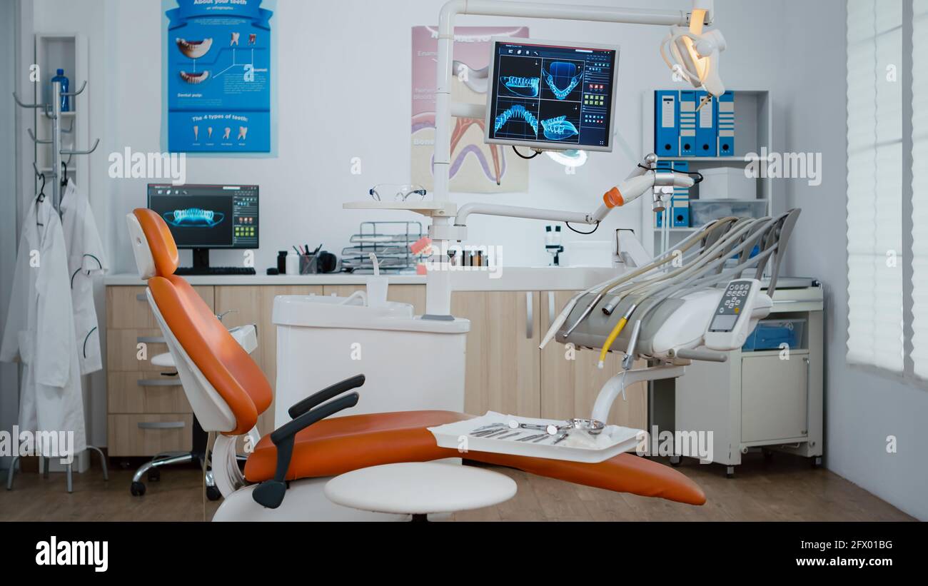 Interior of modern equipped dental office with x ray on monitors ...