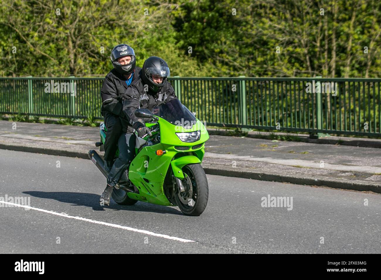 2019 Green Kawasaki; Motorbike rider; two wheeled transport ...