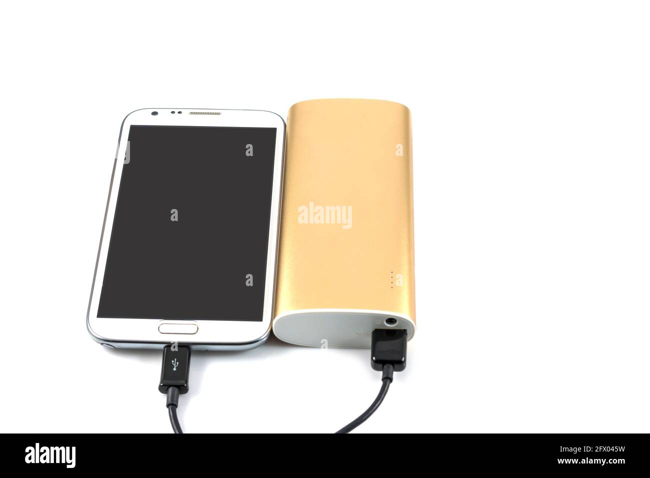 Gold power bank charging white smart phone on white background Stock ...