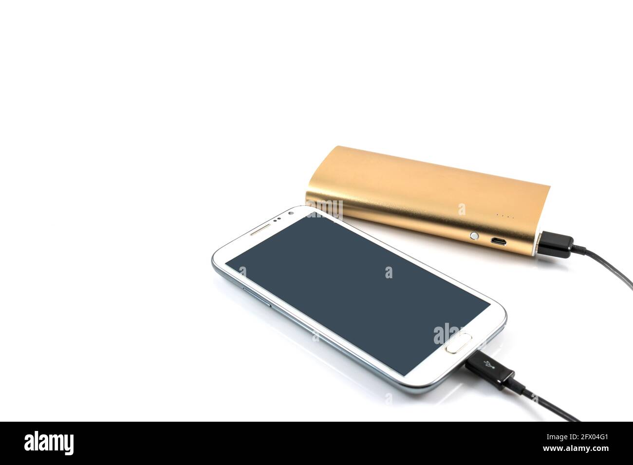 Gold power bank charging white smart phone on white background Stock ...