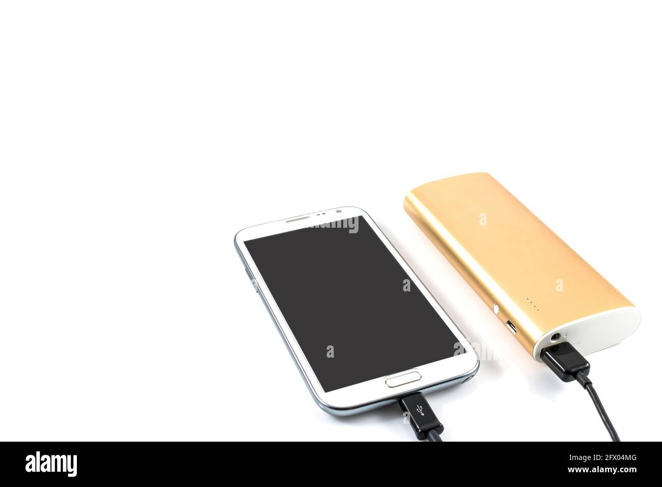 Gold power bank charging white smart phone on white background Stock ...