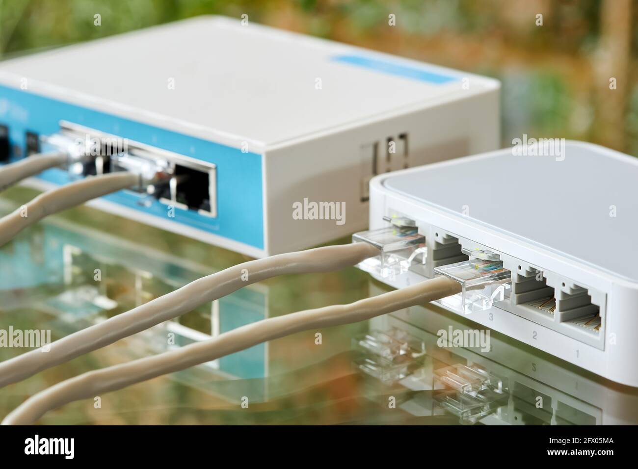 Ethernet cables connected to Desktop Switch and routerboard. Close-up ...