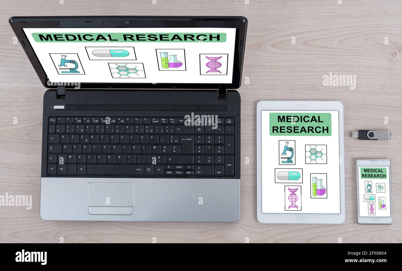 Medical research concept shown on different information technology ...