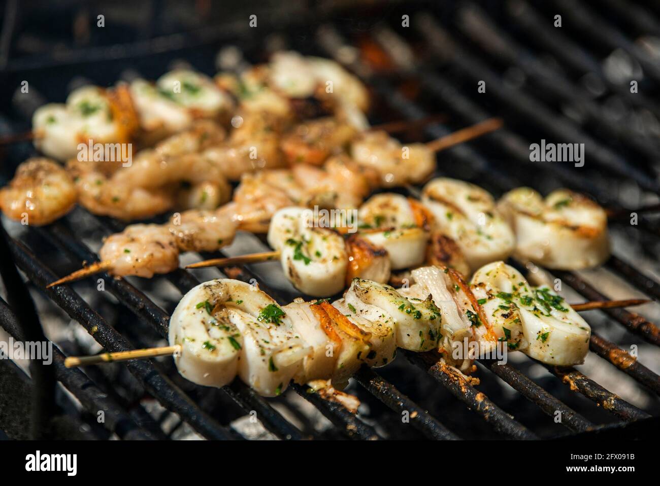 Fish skewers on the grill 5 Stock Photo - Alamy