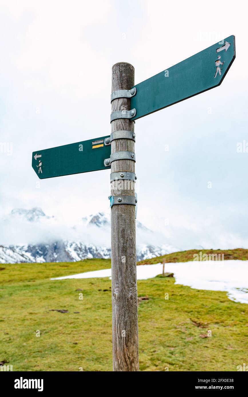 Low angle of direction pole with simple boards showing directions of ...