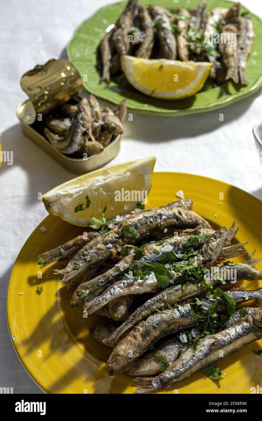 From above plate of appetizing grilled anchovies served on table with ...