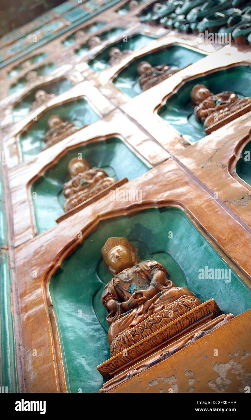Statues on the wall Stock Photo - Alamy