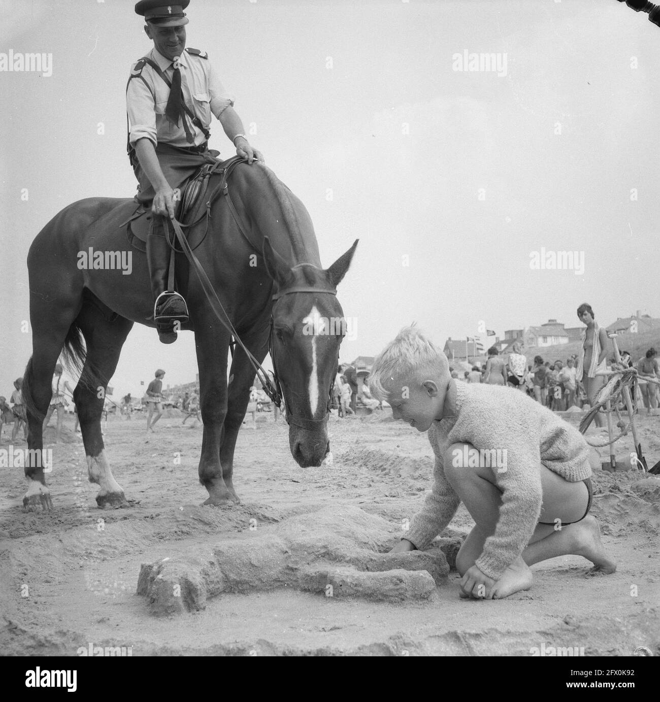 Sand building competition at Zandvoort, winner Jaap van de Bijl working ...