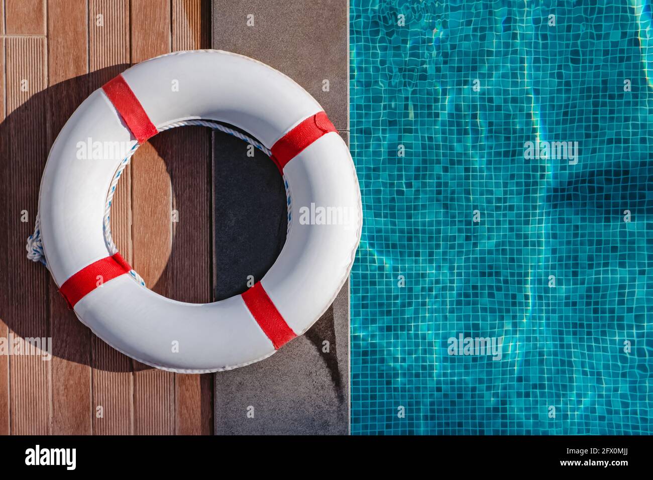 Top view of lifebuoy lying near the swimming pool Stock Photo - Alamy