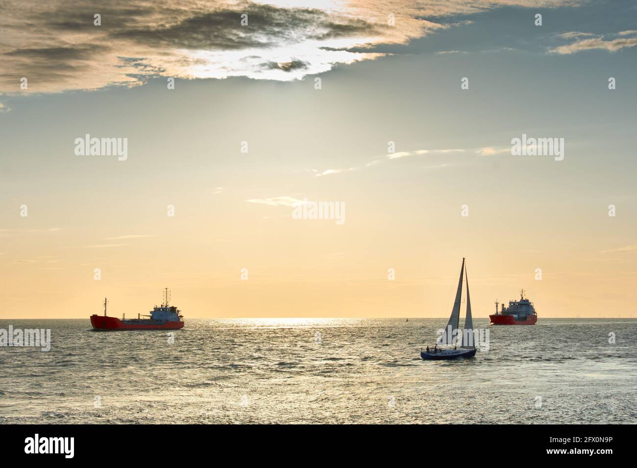 ships at sunset Stock Photo - Alamy