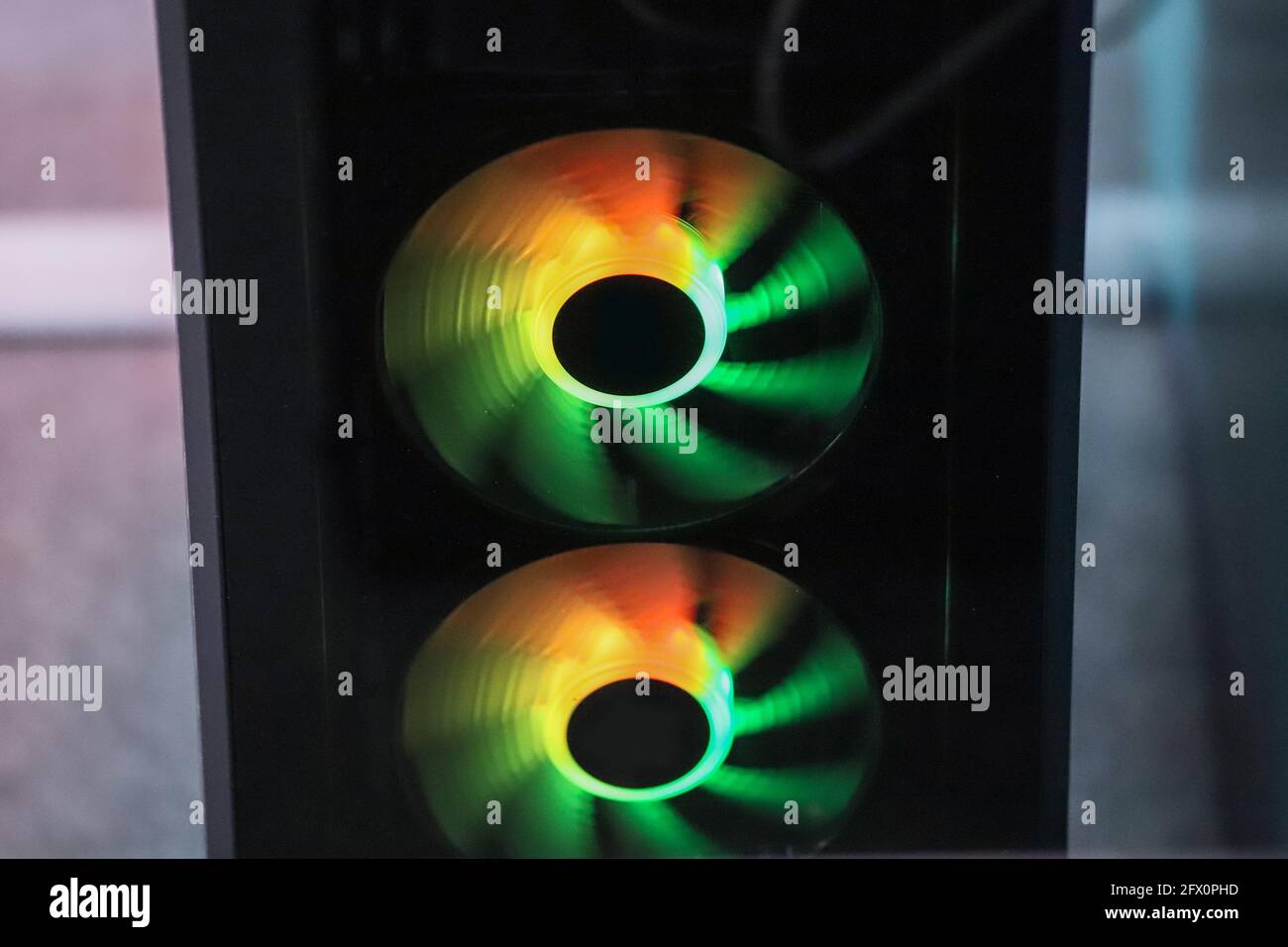 Green, green and yellow illumination of a cooler PC system unit ...