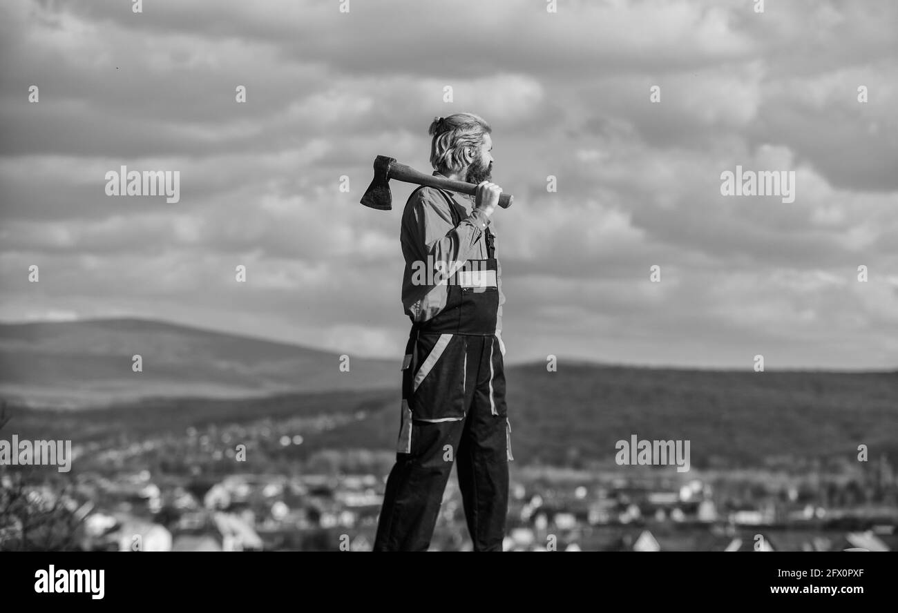 Hard labour. Use axe construction. Renovation tools. Handsome guy ...