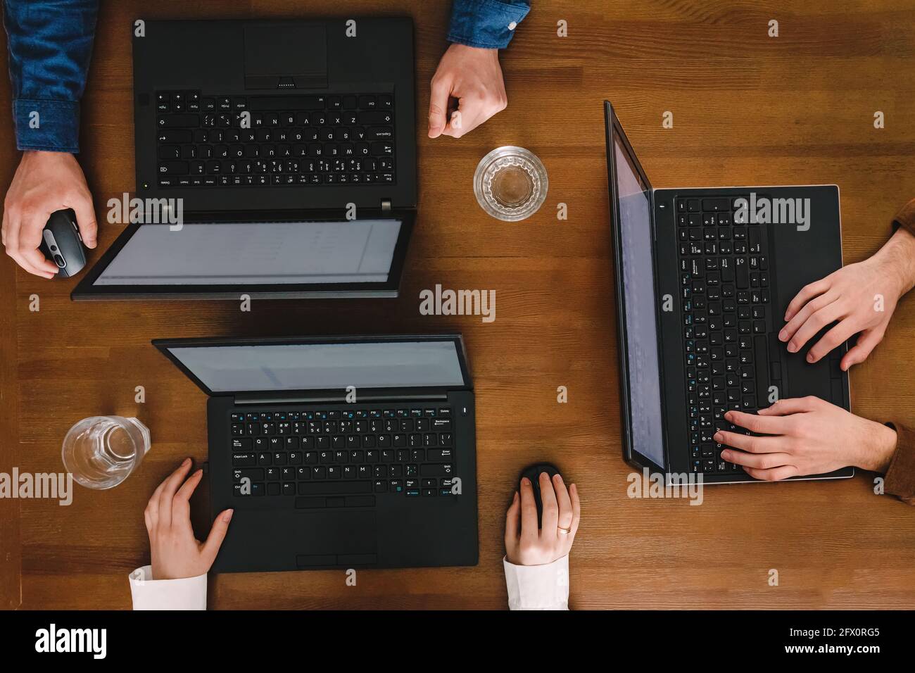 Four unrecognizable people hi-res stock photography and images - Alamy