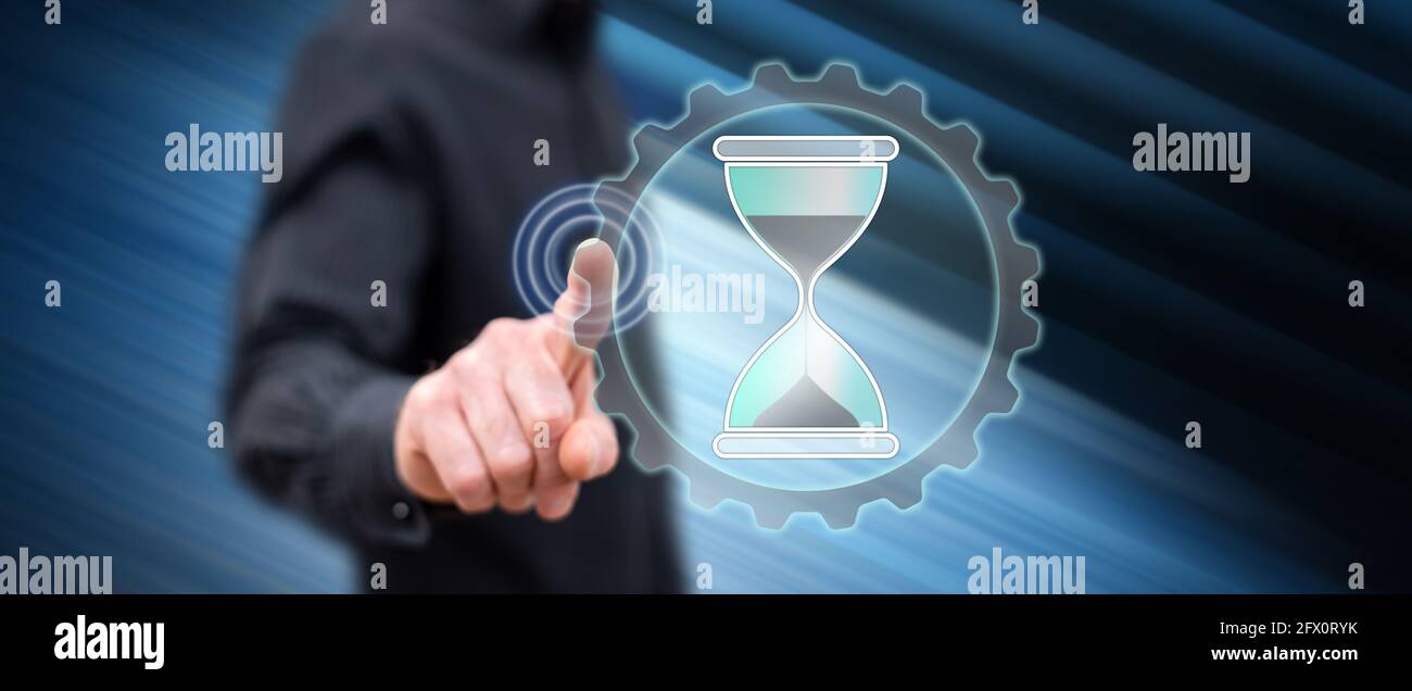 Man touching a time management concept on a touch screen with his ...