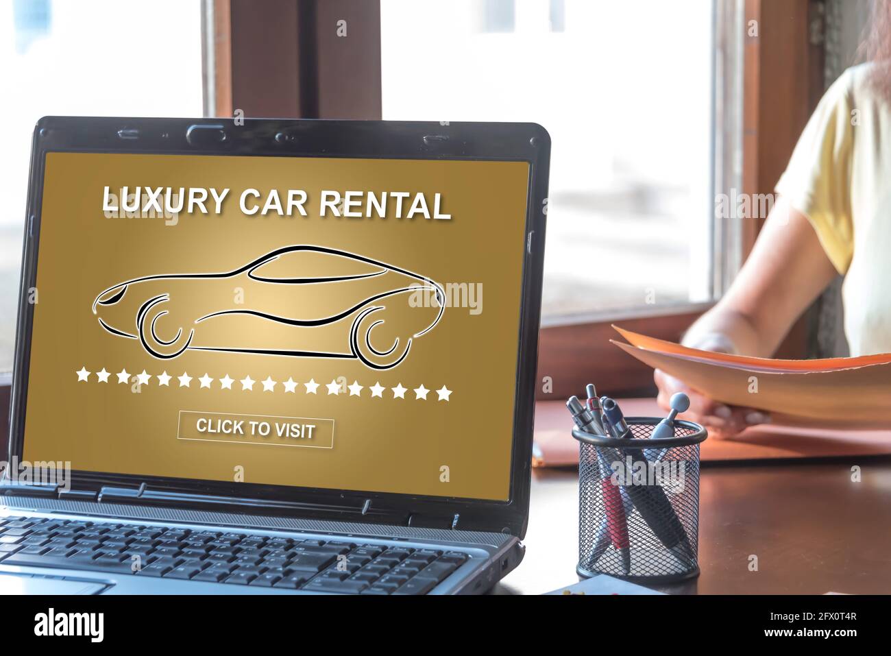 Laptop screen displaying a luxury car rental concept Stock Photo - Alamy
