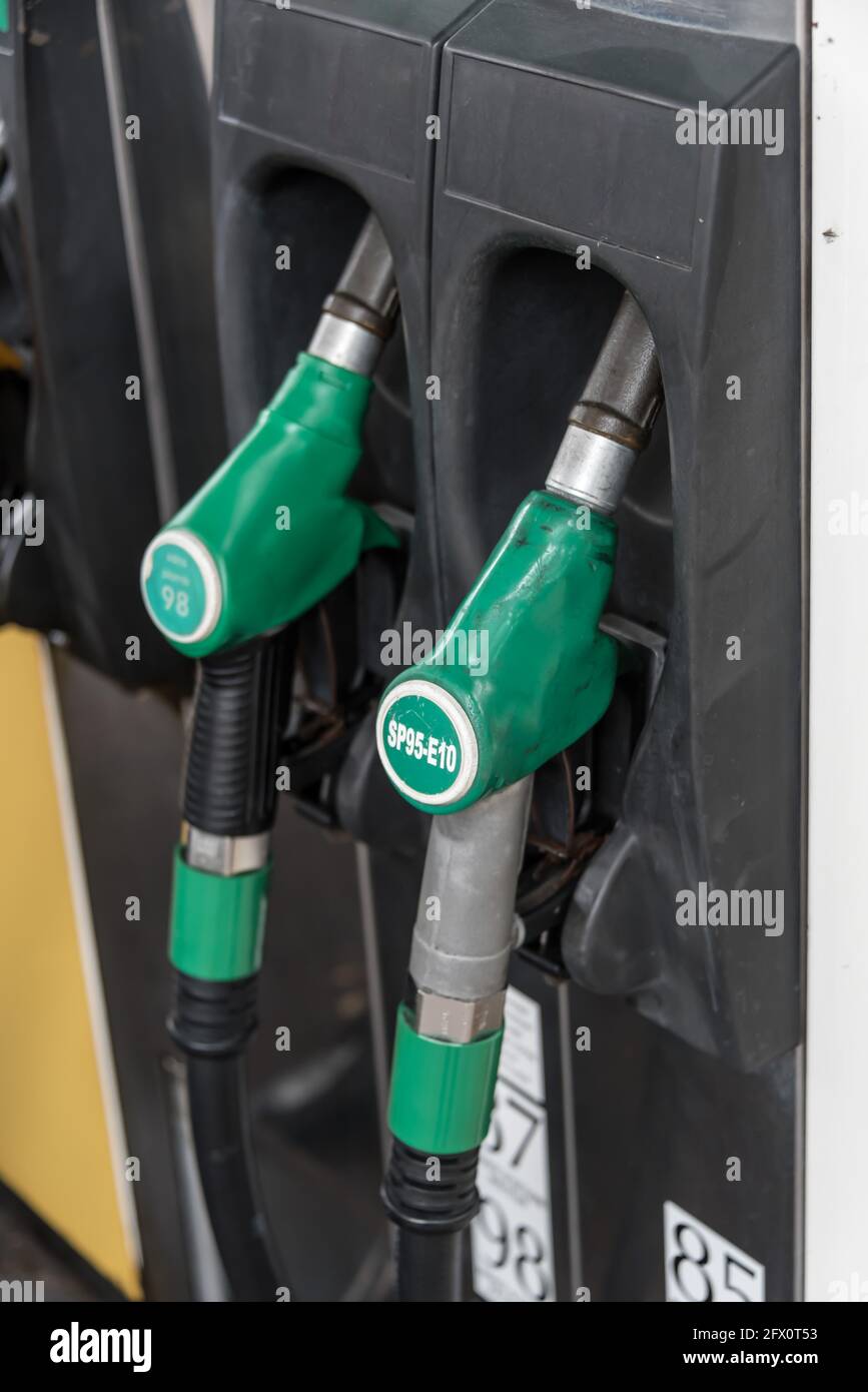 Green fuel pump nozzle Stock Photo - Alamy
