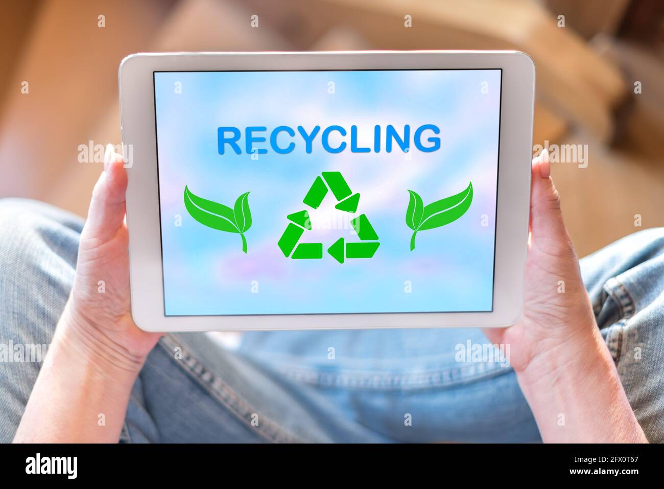 Tablet screen displaying a recycling concept Stock Photo - Alamy