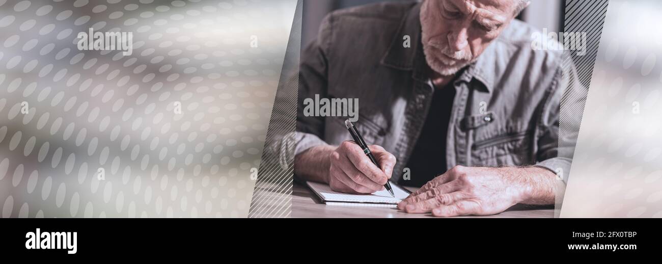 Mature man taking notes on a notebook. panoramic banner Stock Photo - Alamy