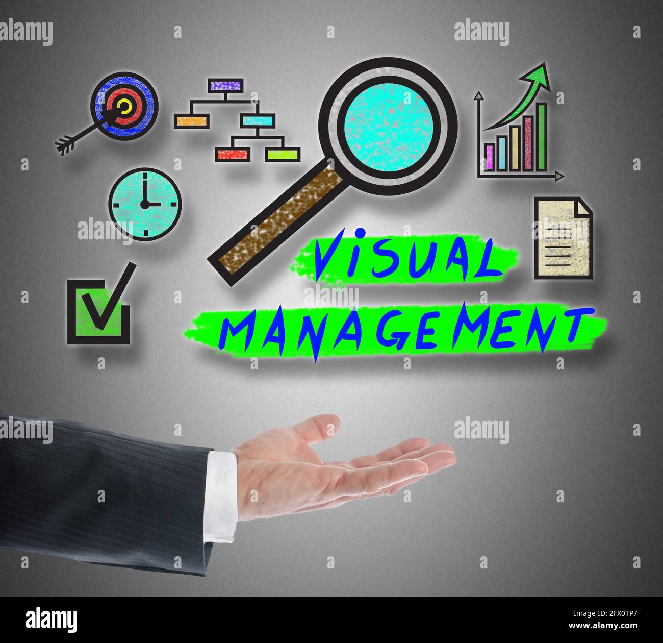 Visual management concept levitating above a hand on grey background ...
