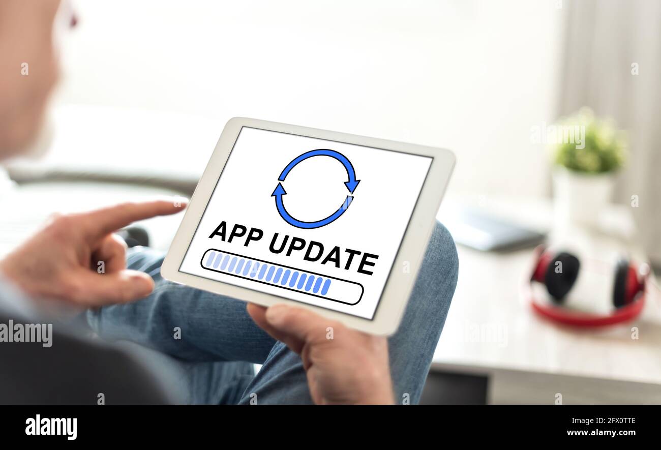 Tablet screen displaying an app update concept Stock Photo - Alamy