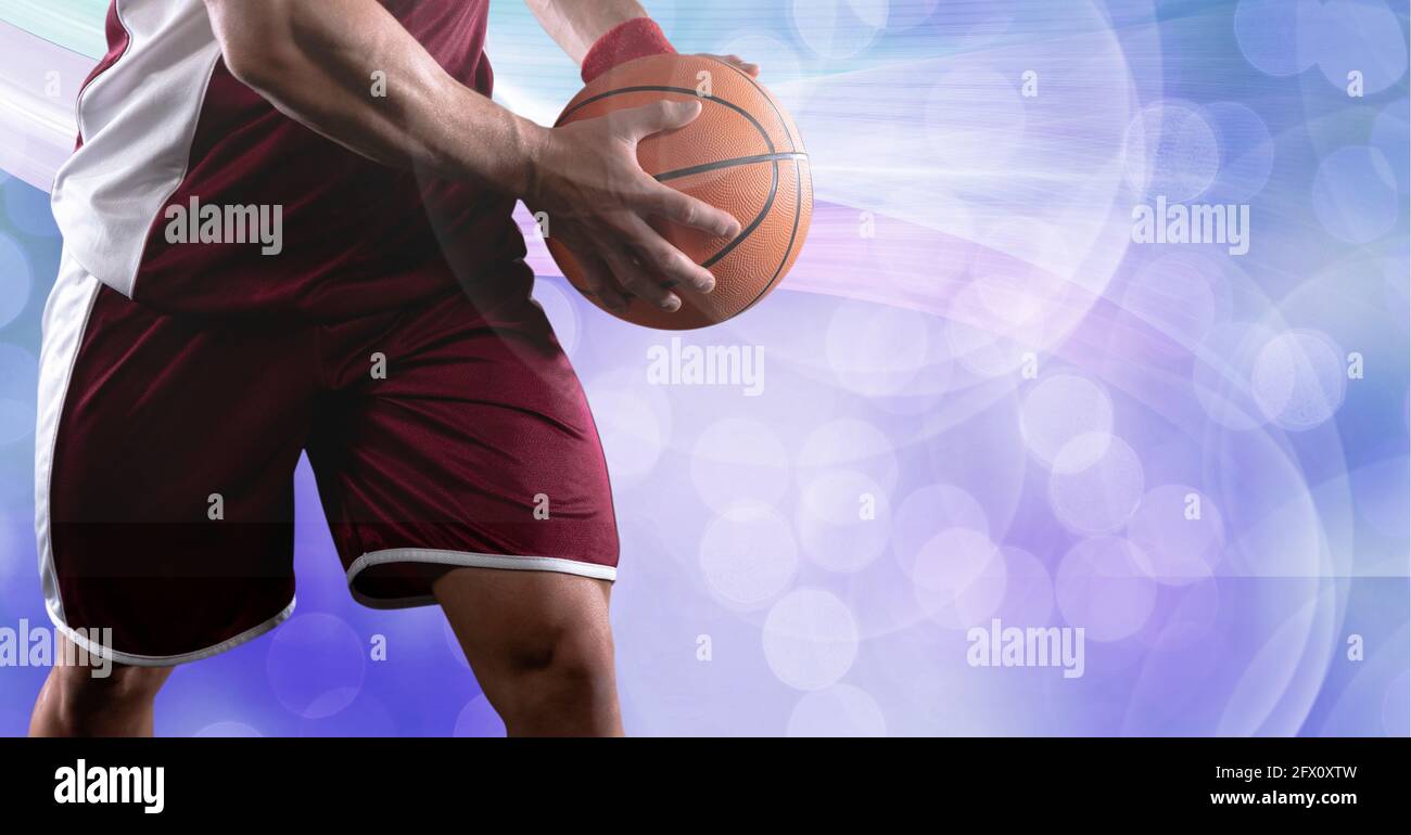 Composition of midsection of basketball player holding ball with copy ...