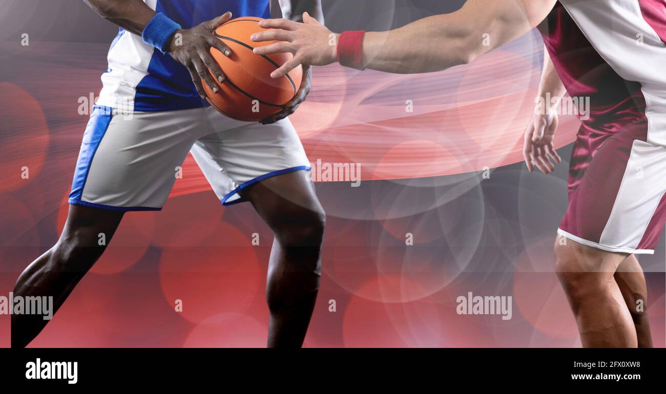 Composition of midsection of basketball players holding ball with copy ...