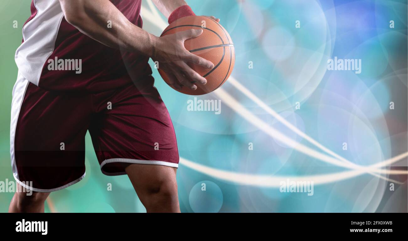 Composition of midsection of basketball player holding ball with copy ...