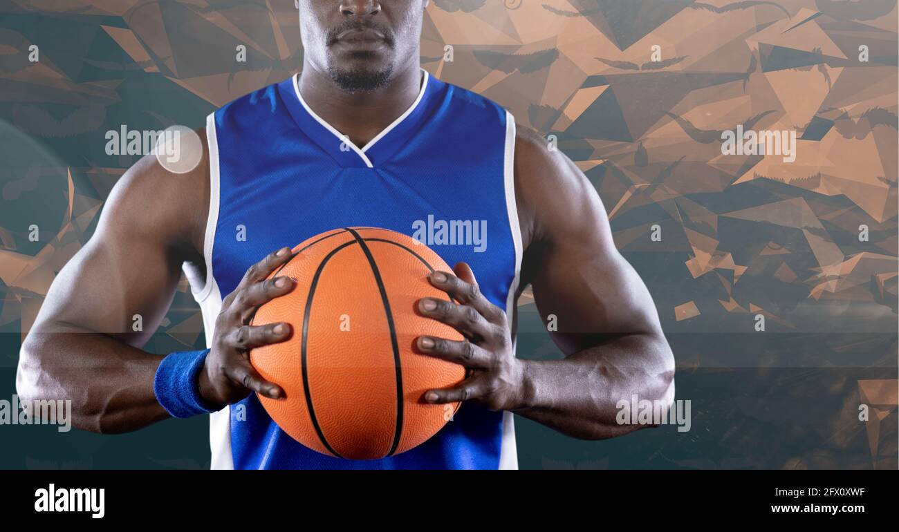 Composition of midsection of basketball player holding ball with copy ...