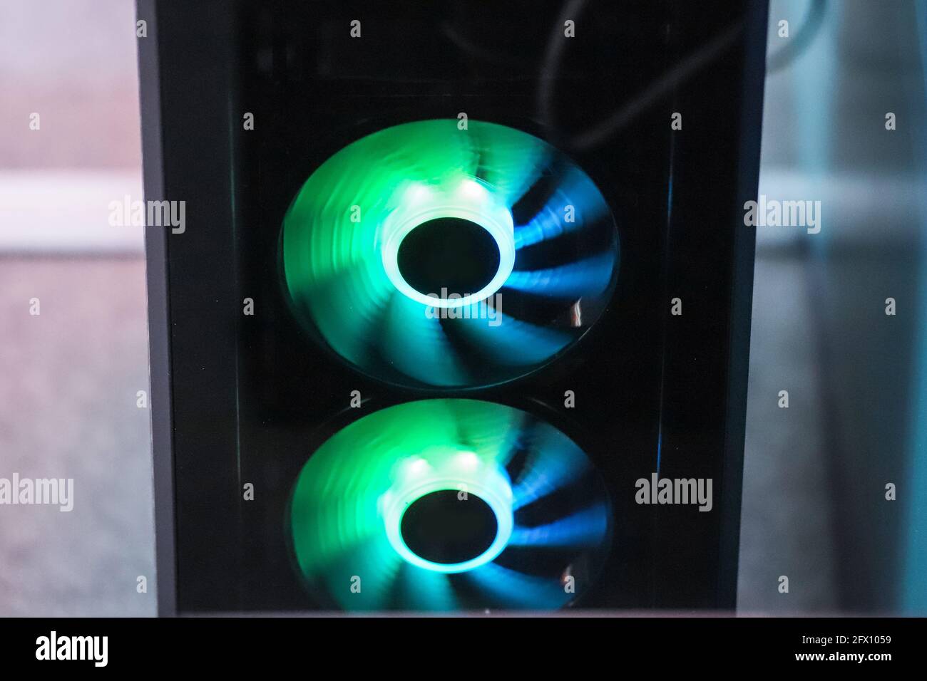 Green, green and yellow illumination of a cooler PC system unit ...
