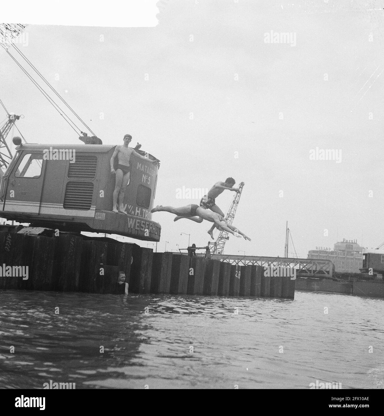 Swimming in Metro well. Boys dive into the water, June 22, 1961, DIVING ...