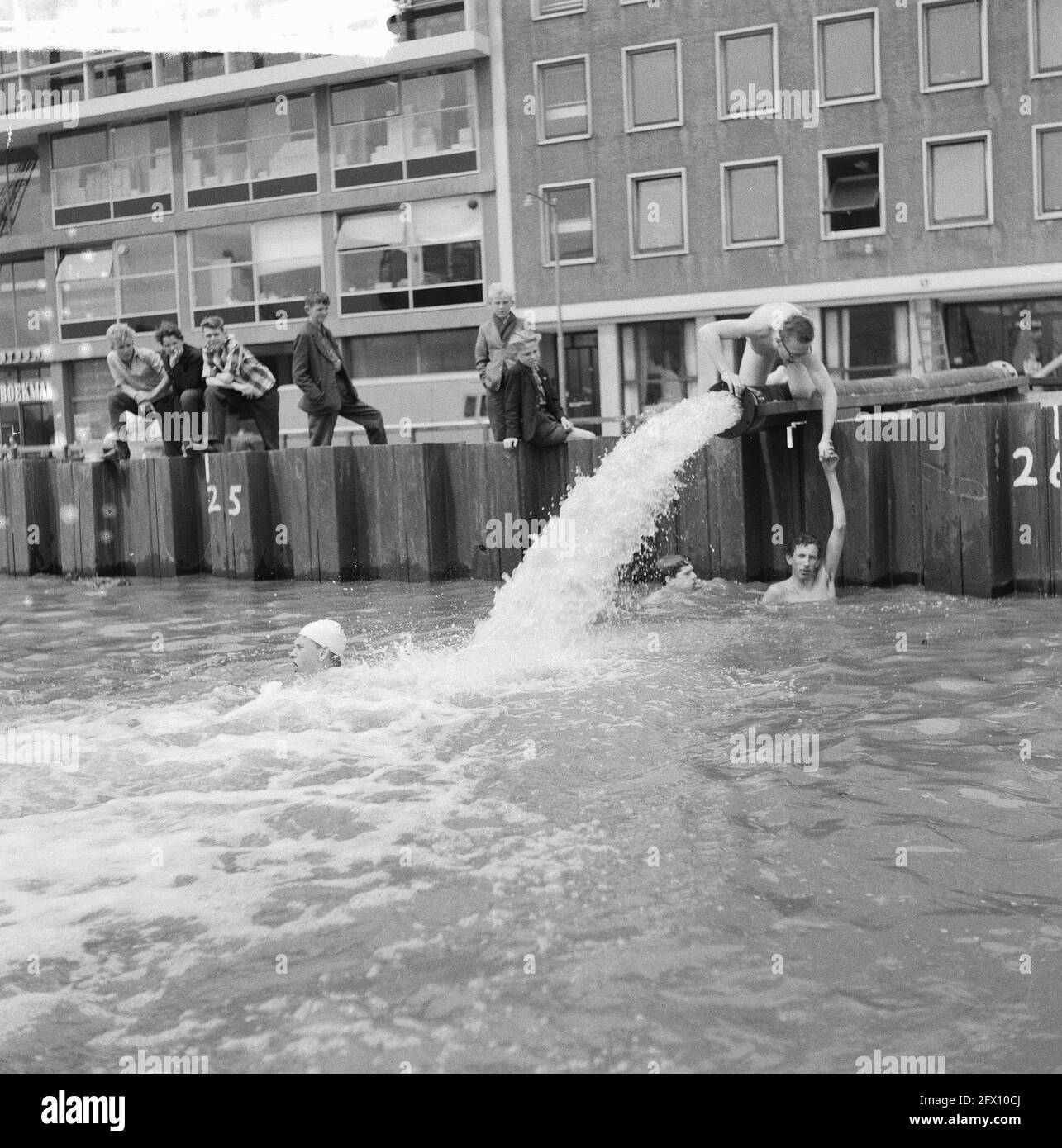 Swimming in Metro well. Boys swimming in the mud water, June 22, 1961 ...